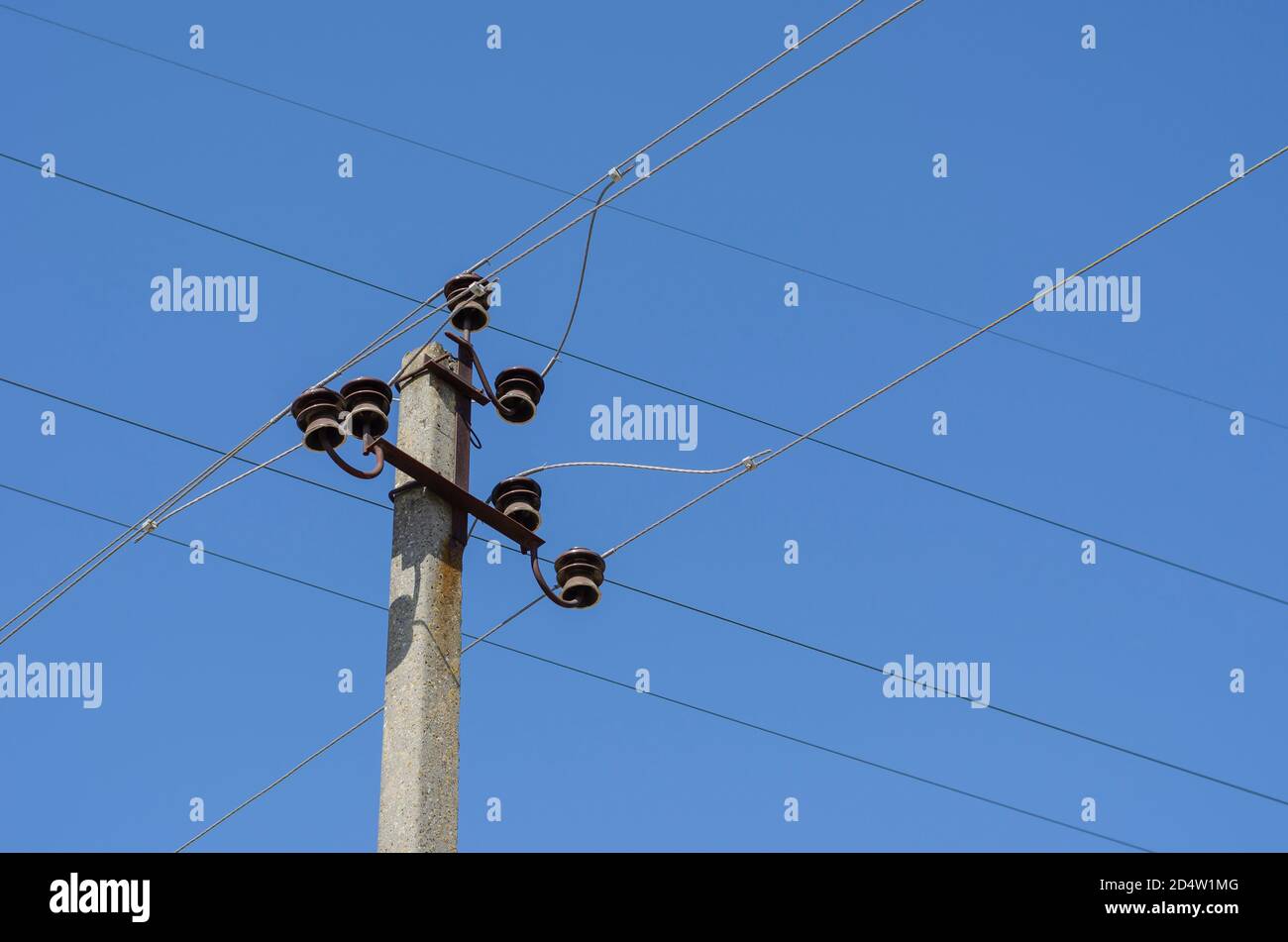 Symmetrical geometric composition of electric wires against the blue ...