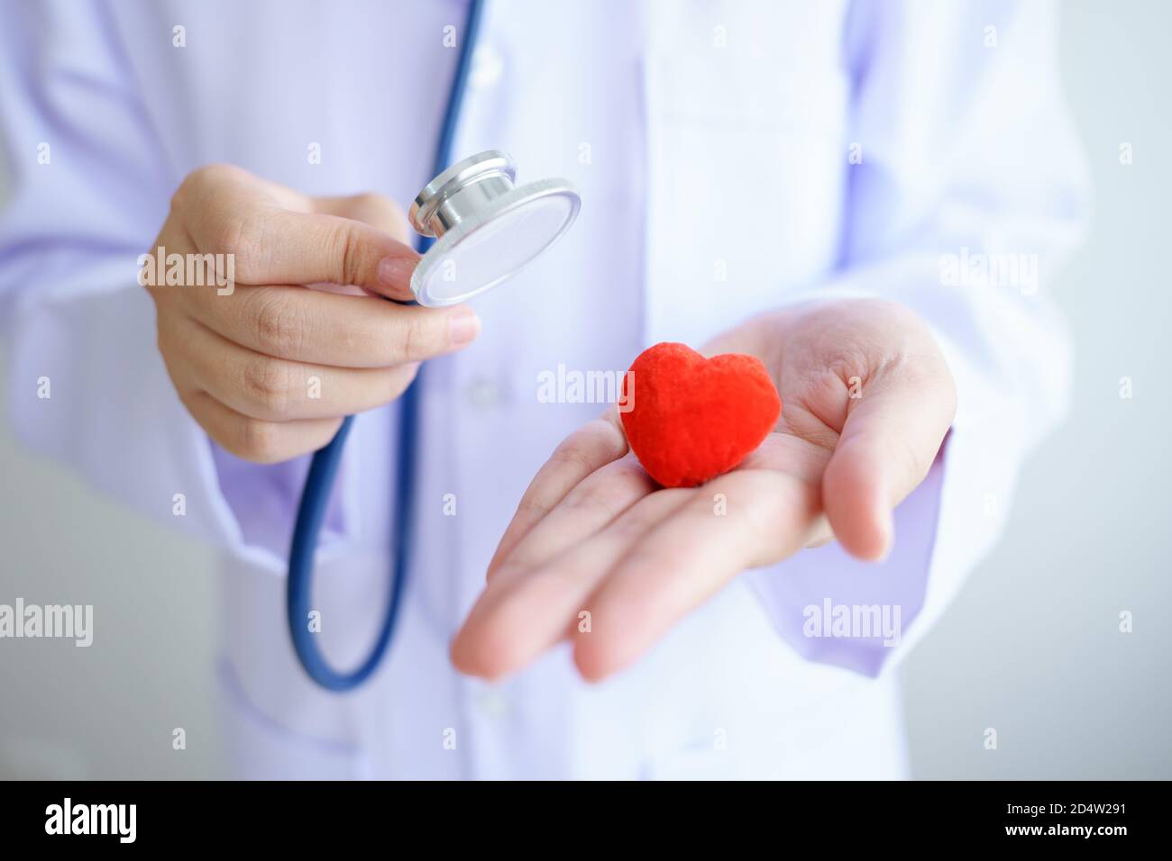 Heart check Doctor holding Red heart on hands at hospital office ...