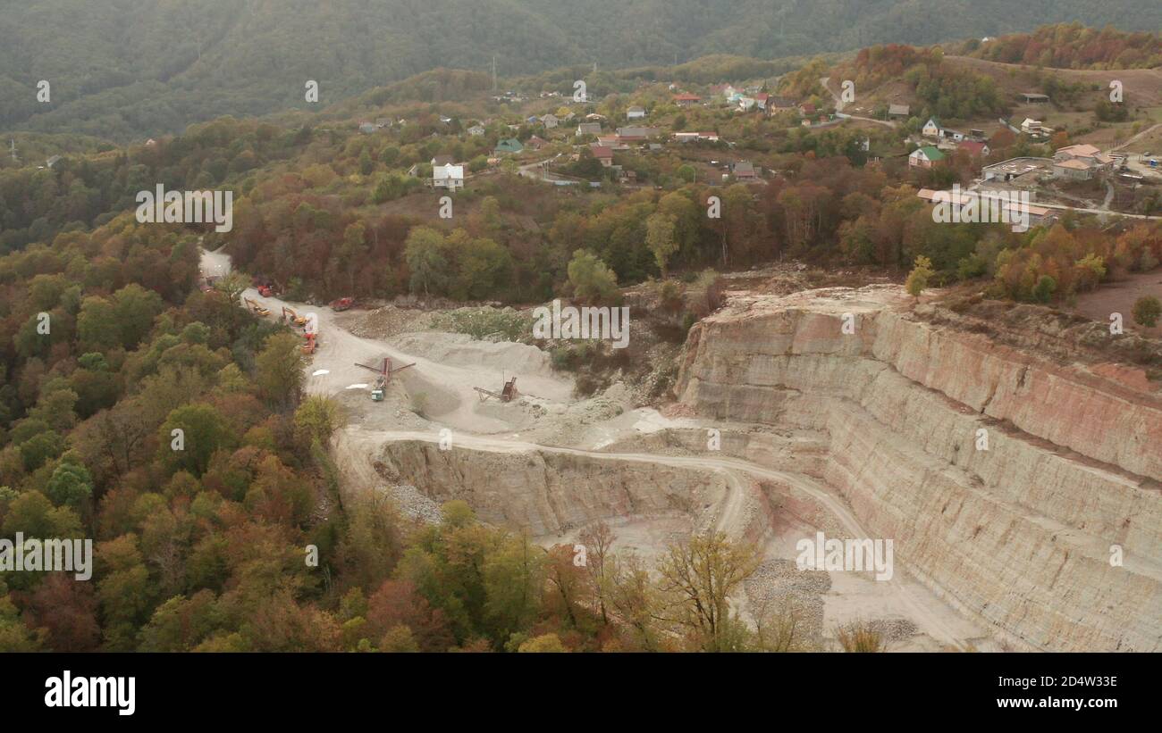 Lime quarry. A quarry where excavators extract limestone Stock Photo ...