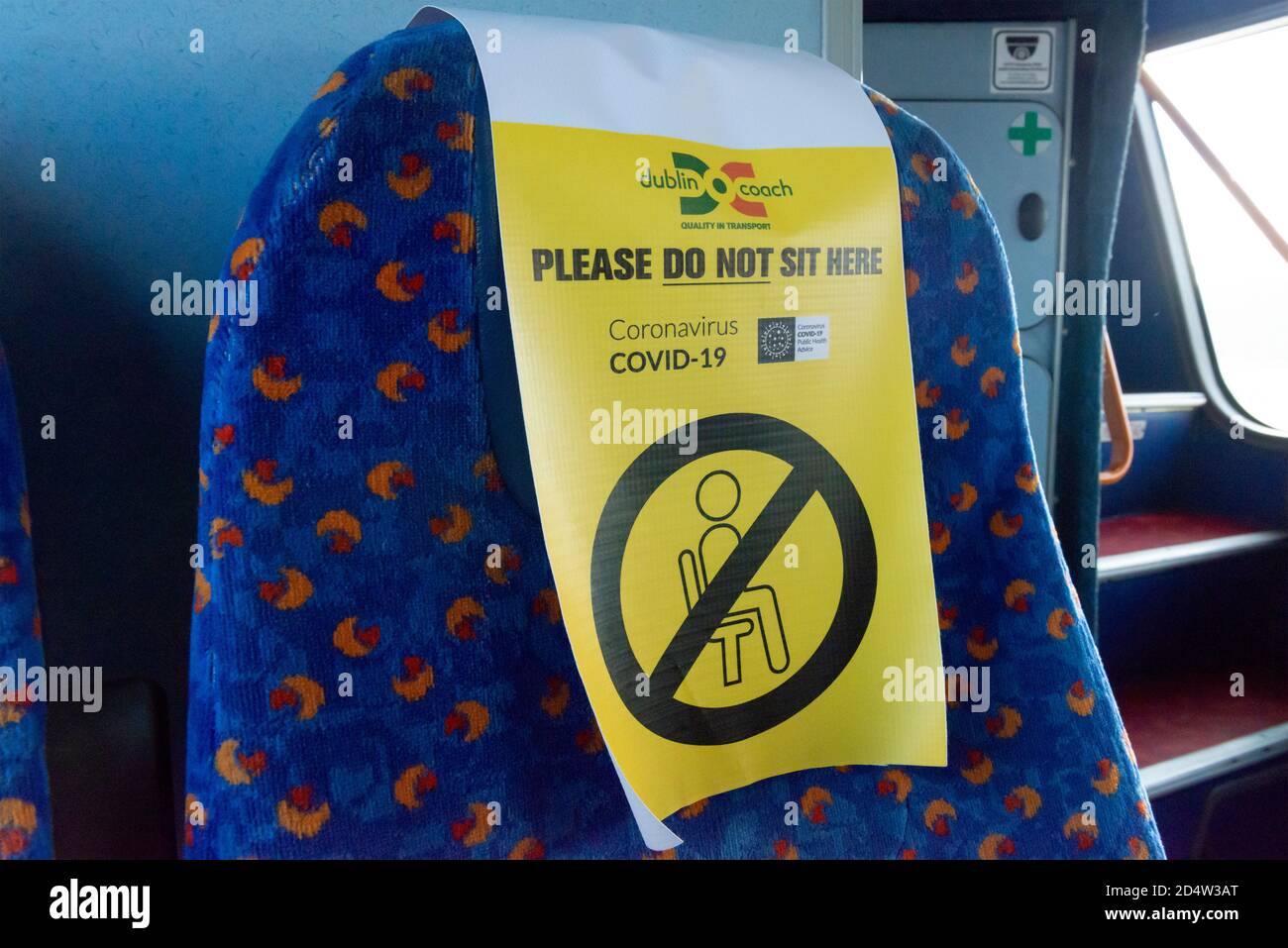 Social distancing yellow sign on seat inside bus by Dublin Coach in ...
