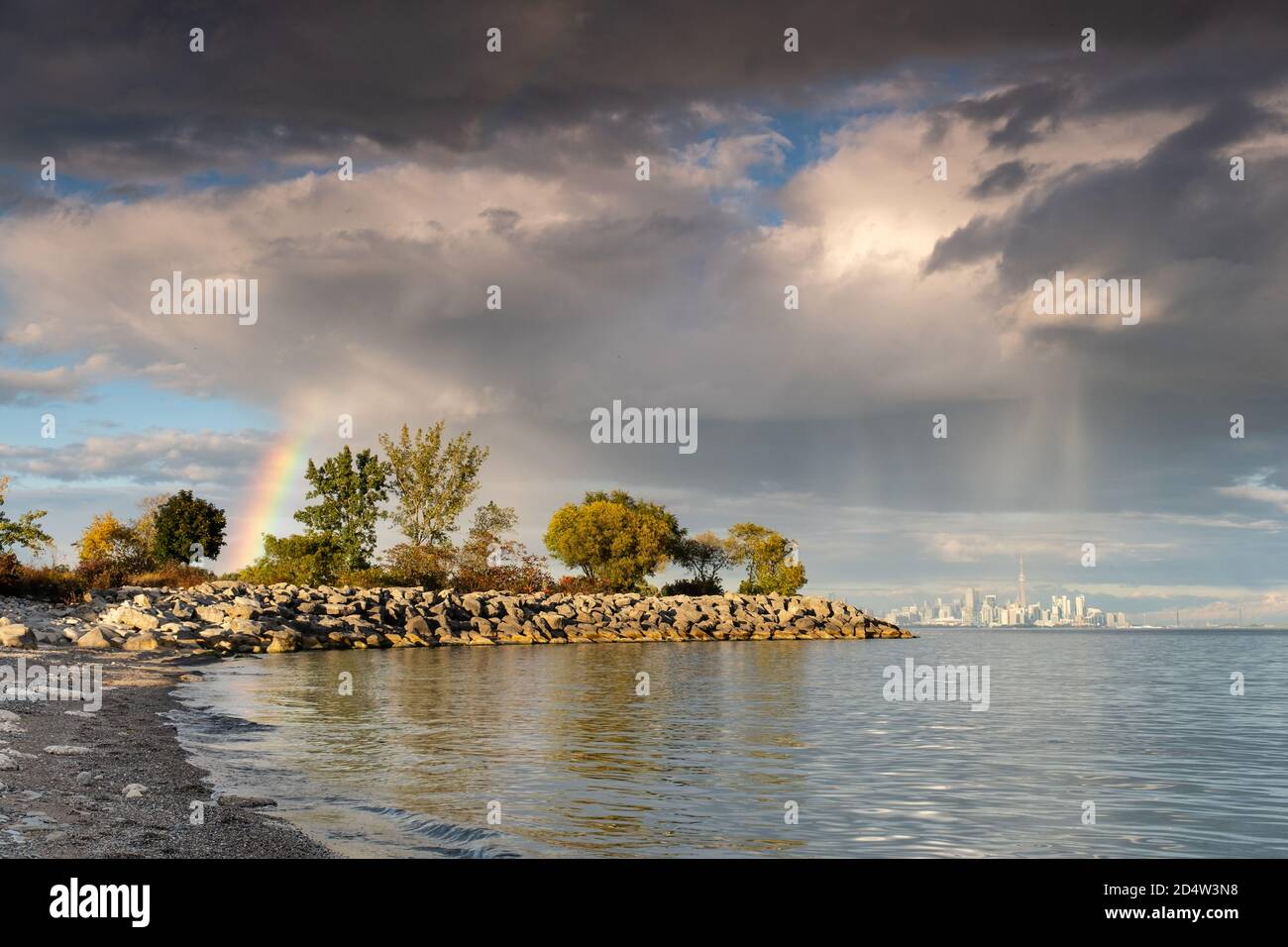 A rainbow begins to appear following a heavy downpour at Toronto's ...
