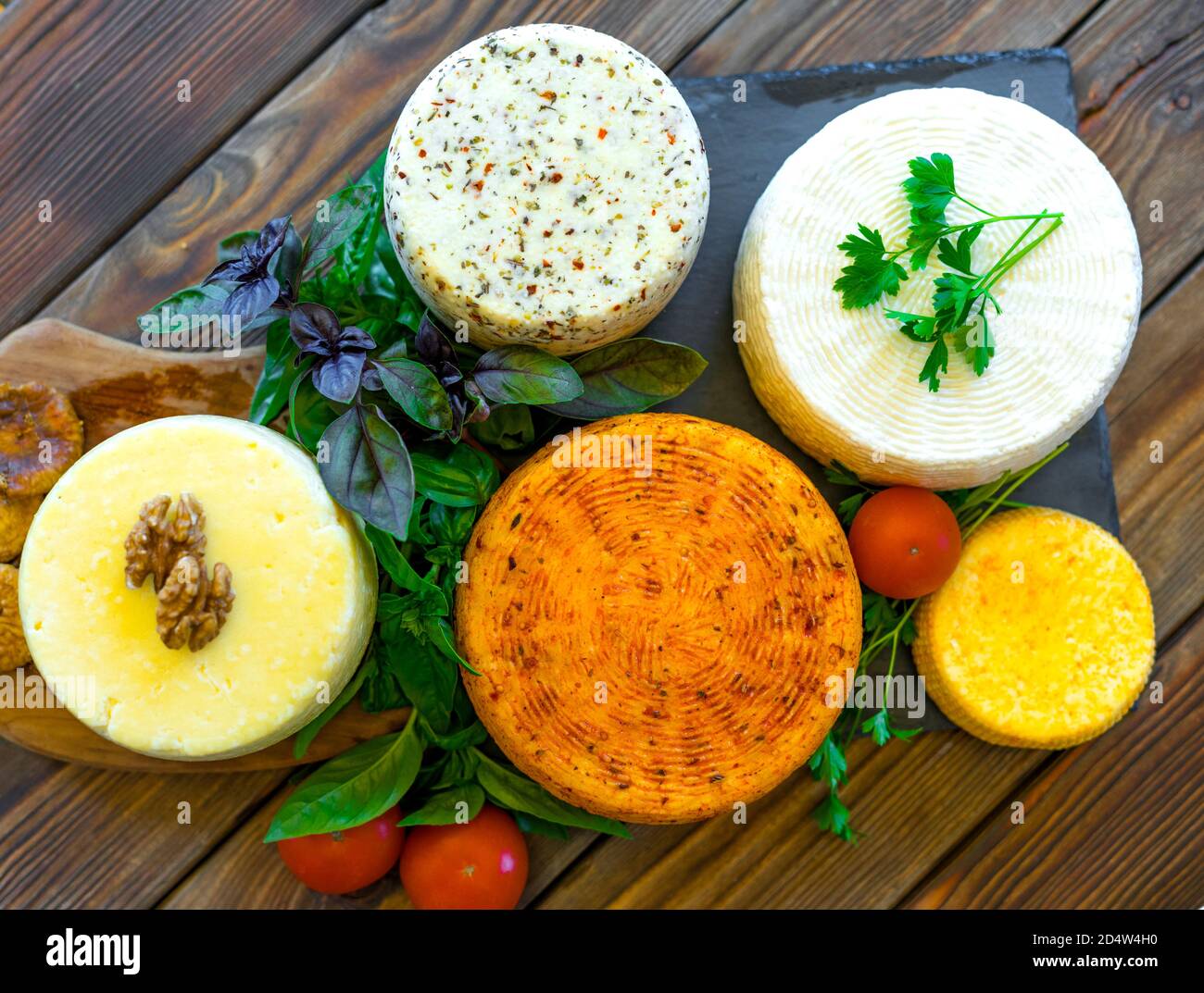 Cheese Heads with cheeses of different kinds. Assortment of different ...