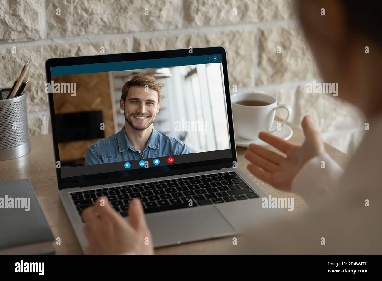 Back view of woman talk on video call with colleague Stock Photo - Alamy