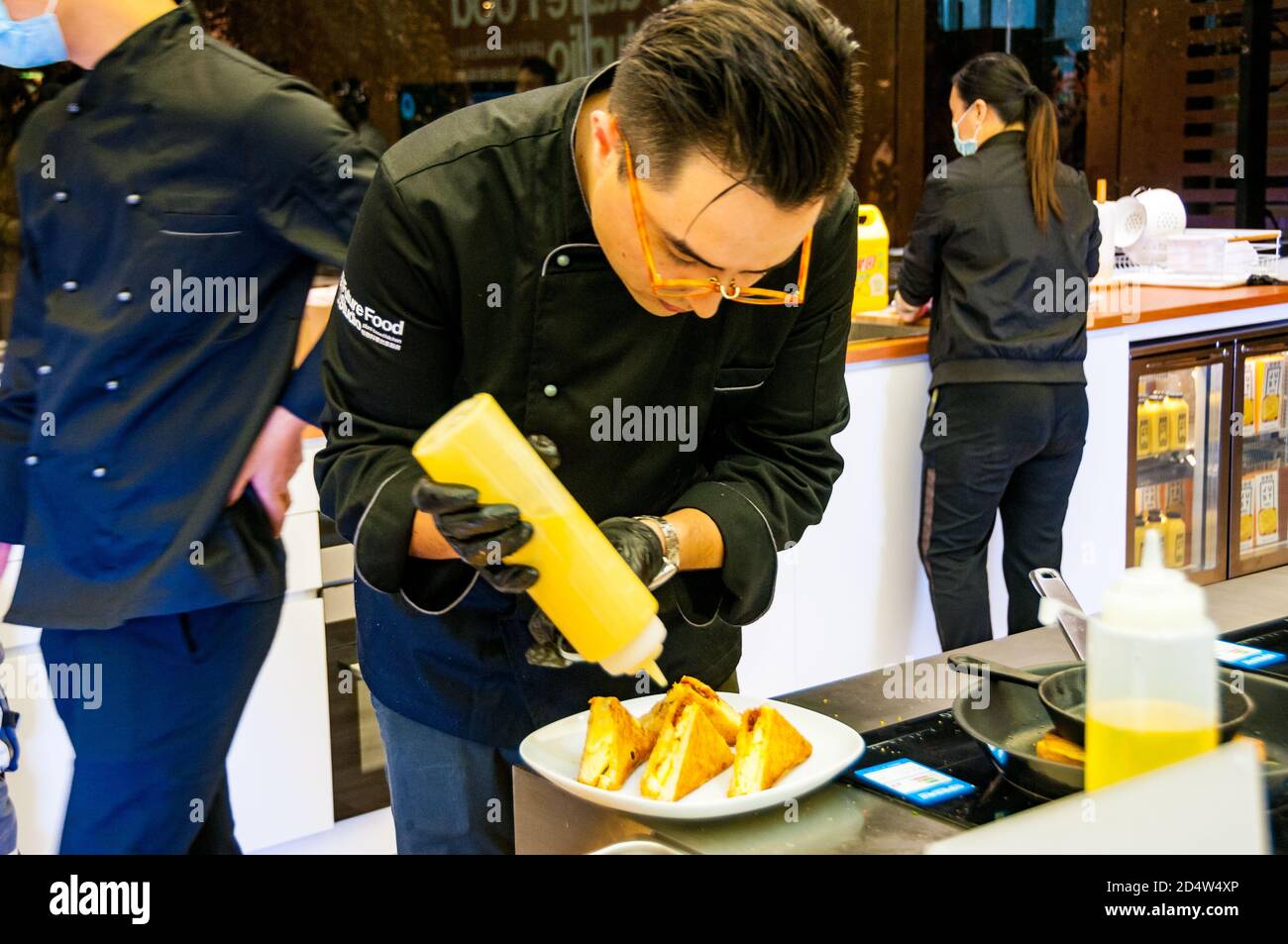 Chef Andrew Moo cooking egg and plant chorizo grilled cheese at the ...