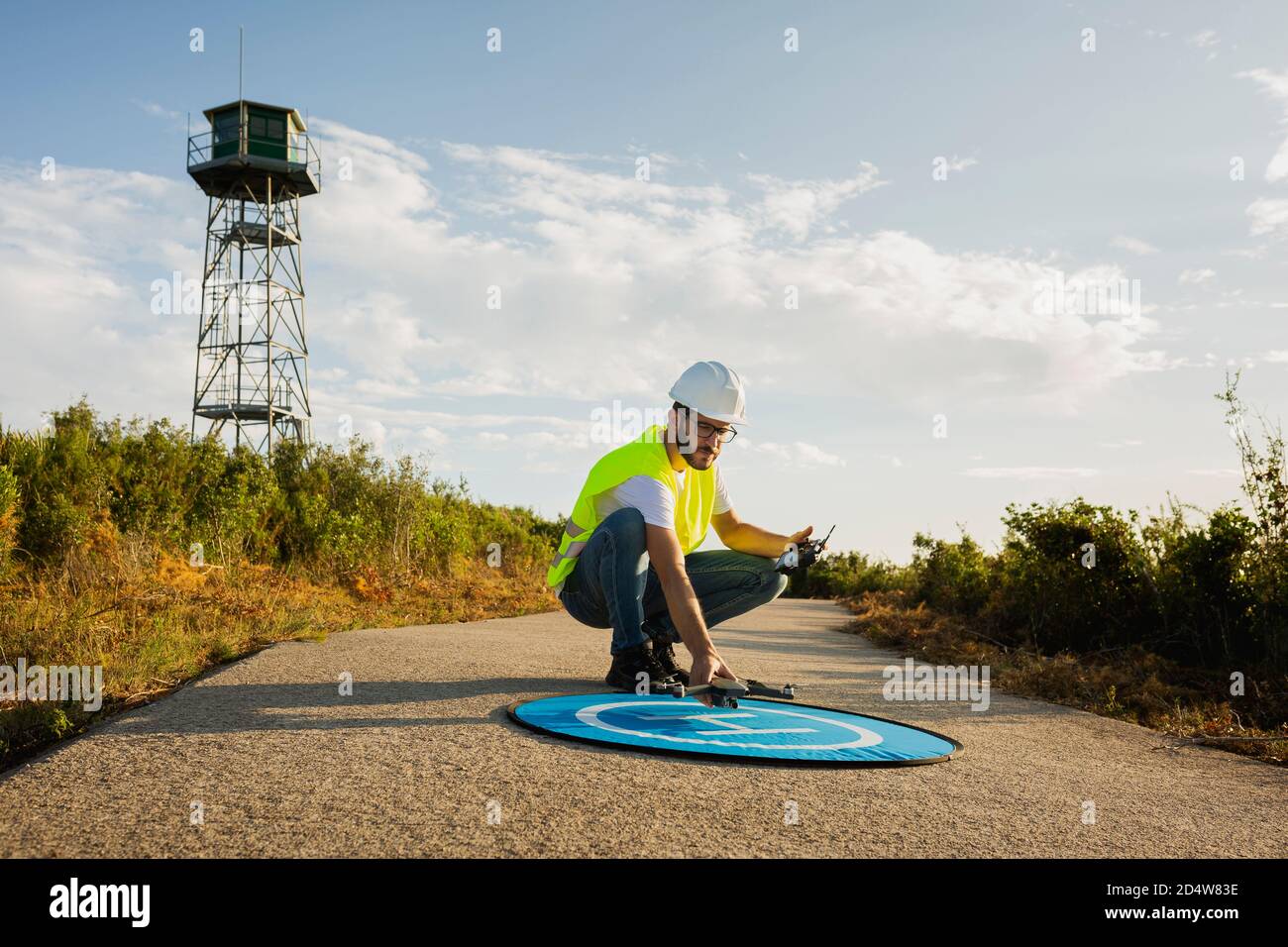 Drone operator man Launching a drone on a countryside environment Stock ...