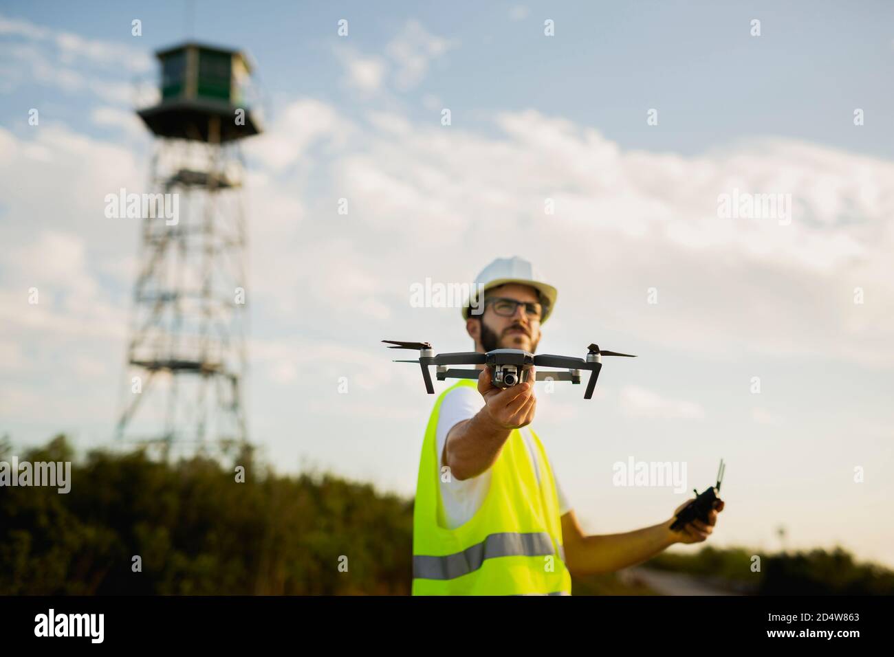 Drone operator man Launching a drone on a countryside environment Stock ...