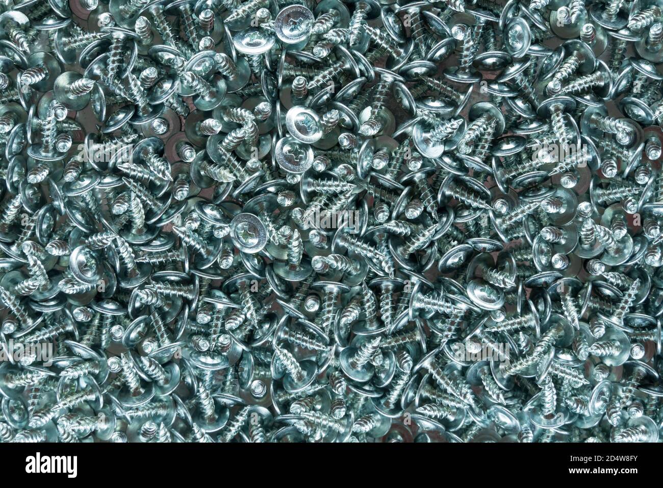 Metal background. Screws and cogs. Tools for fixing and repairing ...