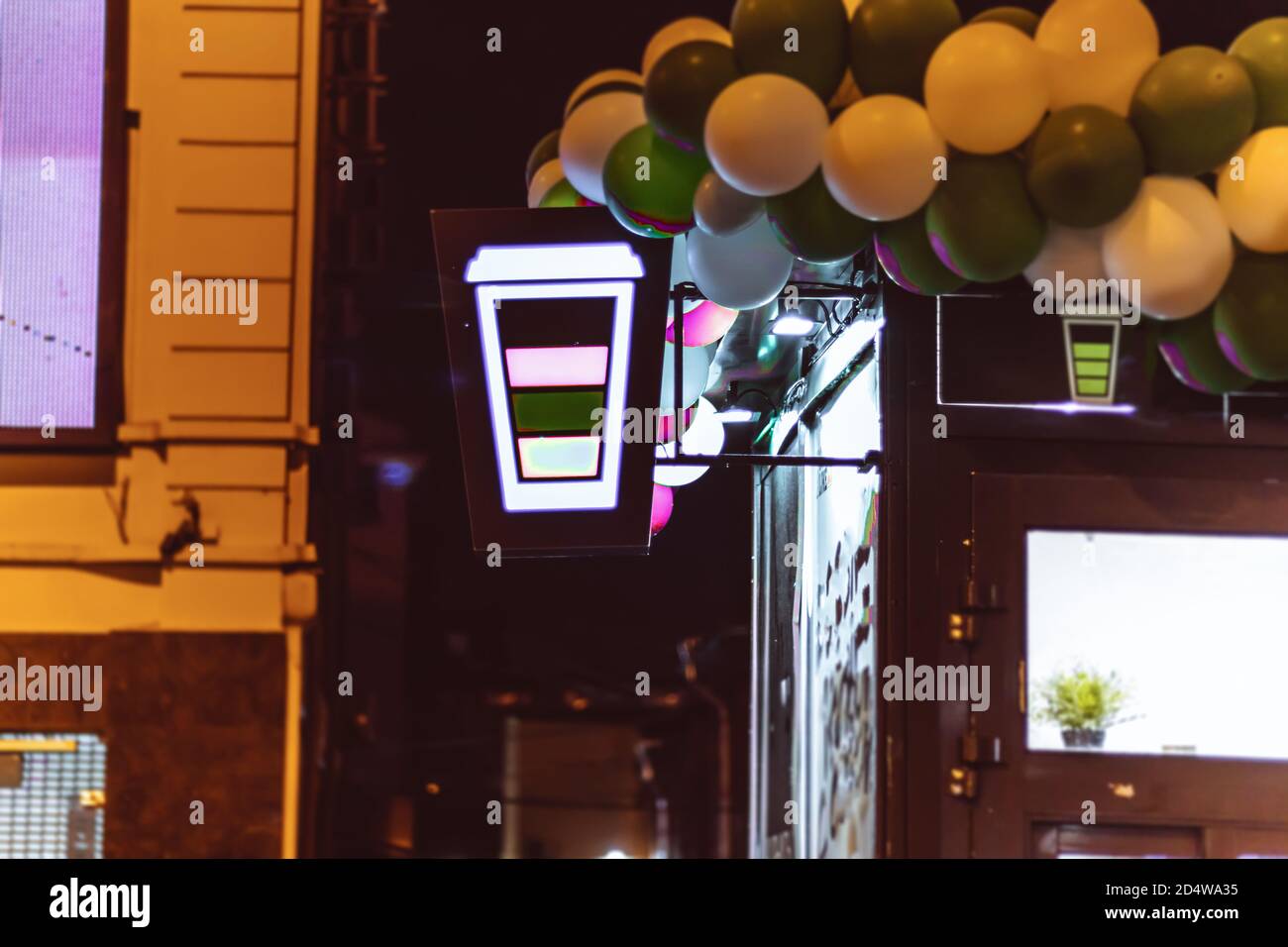 neon icon sign cup coffee glows on the window of the coffee shop at ...