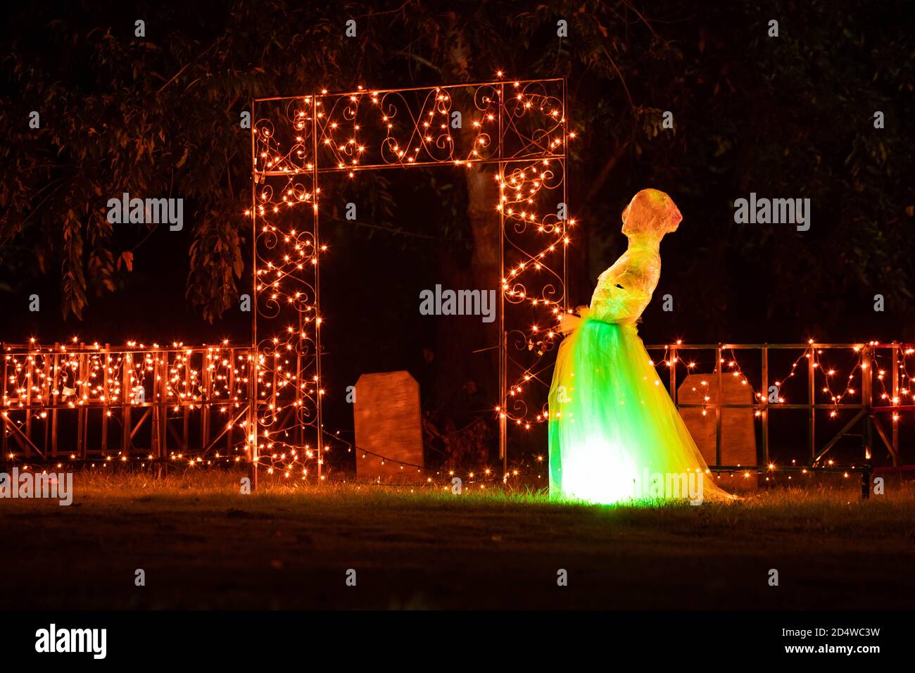 Illuminated scary Halloween ghosts decoration outdoor at night Stock ...