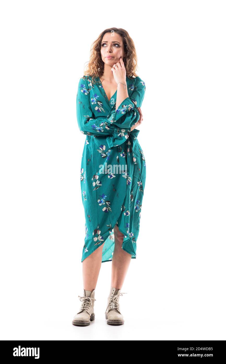 Worried and concerned young emotional woman looking up in hope with ...