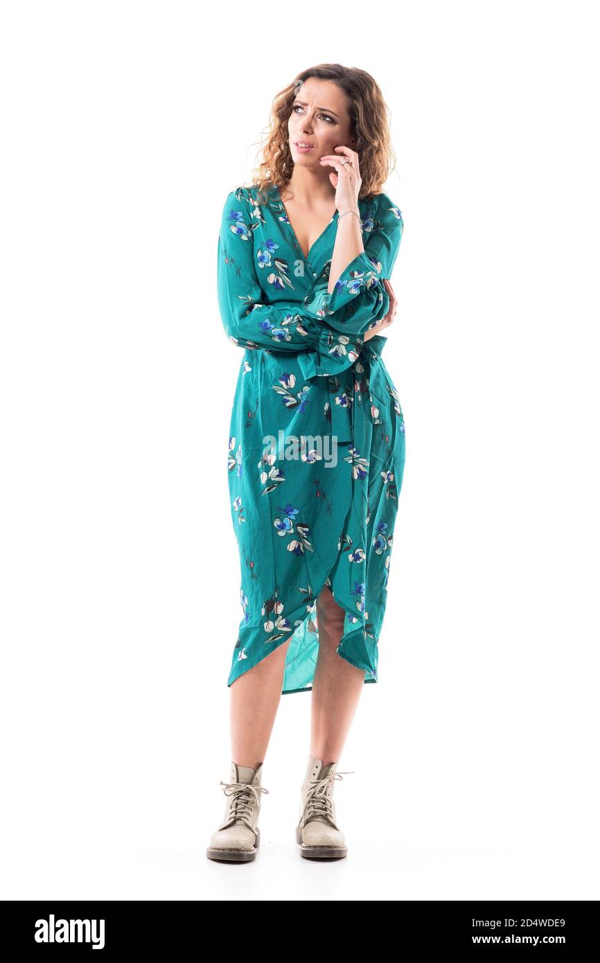 Young unhappy thinking woman looking up with disgusted expression with ...