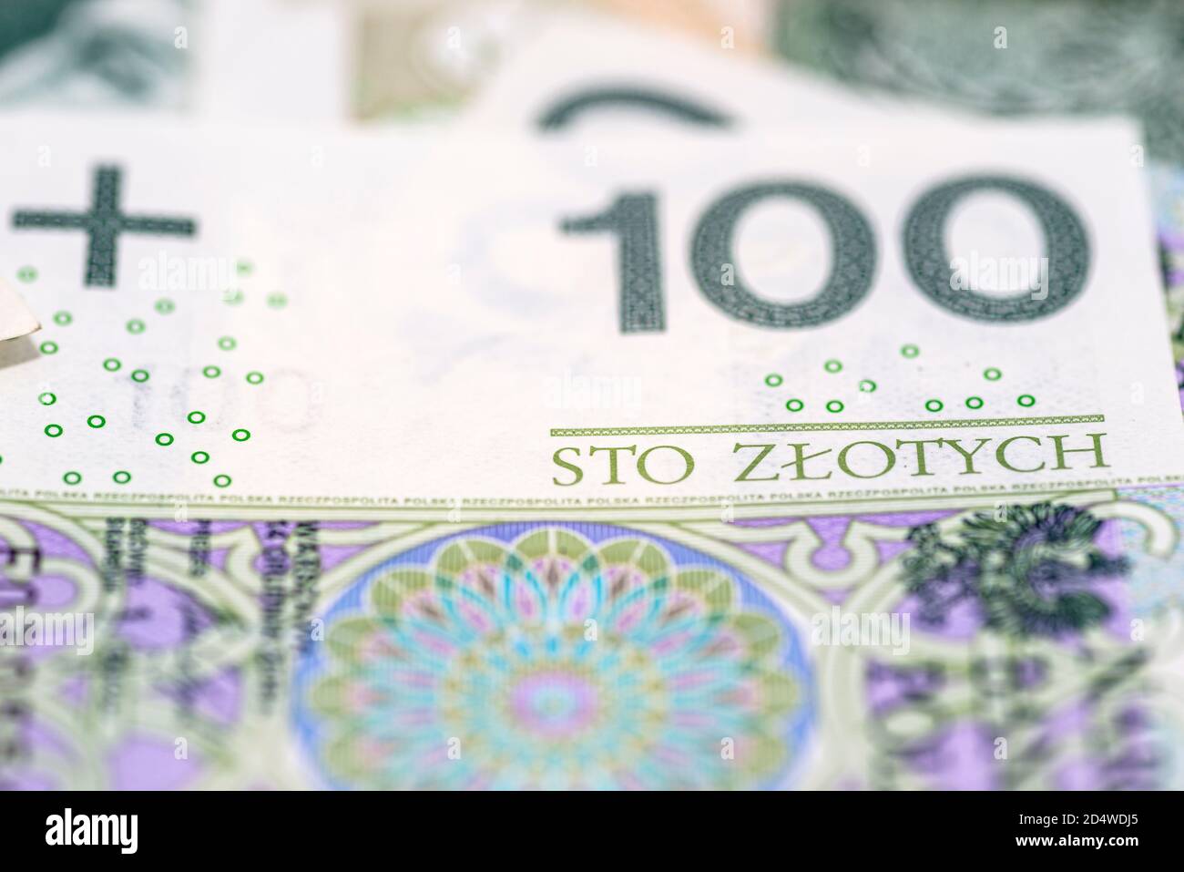 Macro photo of the front side of a Polish 100 PLN banknote, close-up on ...