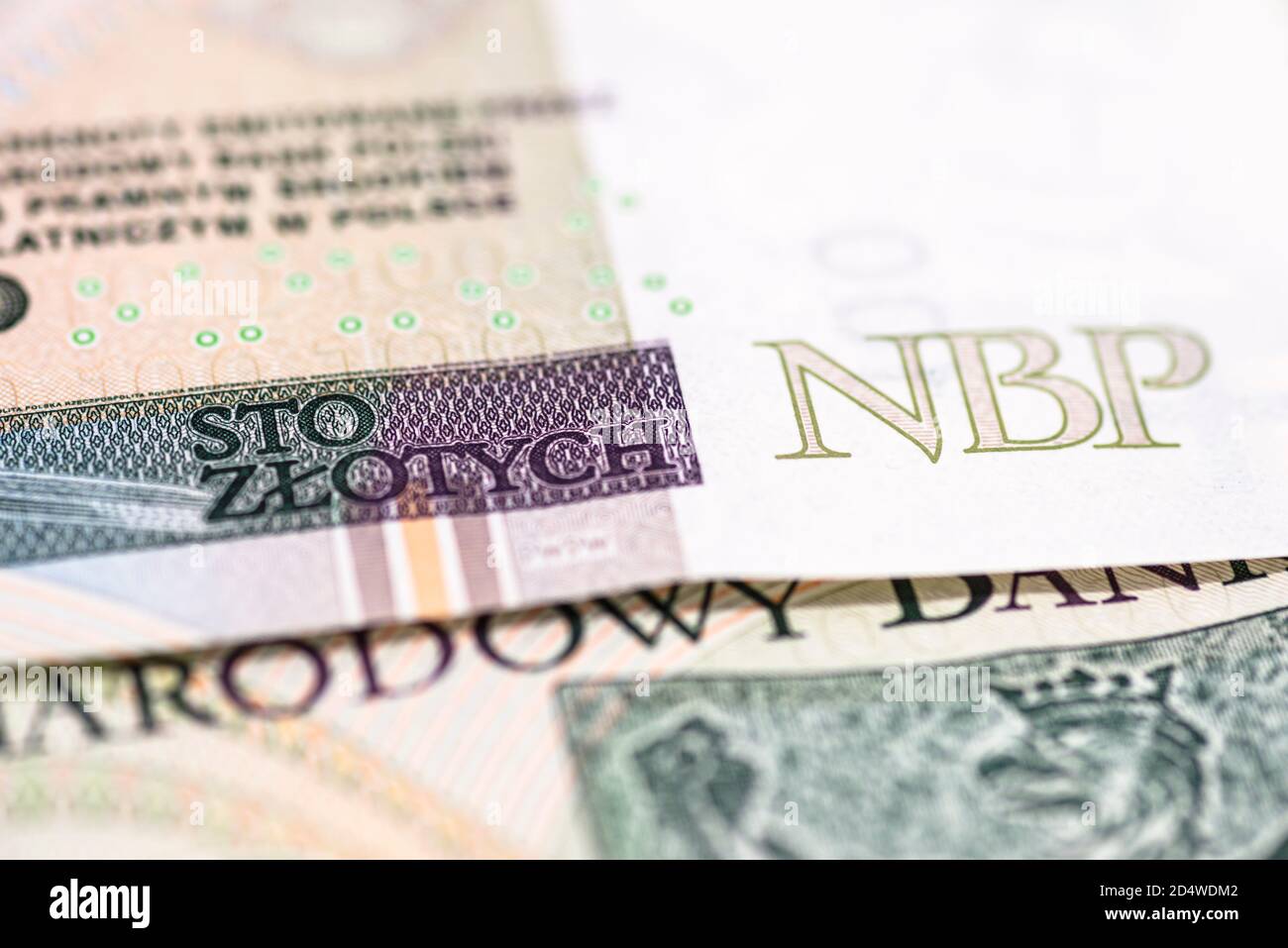 Macro photo of the rear side of a Polish 100 PLN banknote, close-up on ...