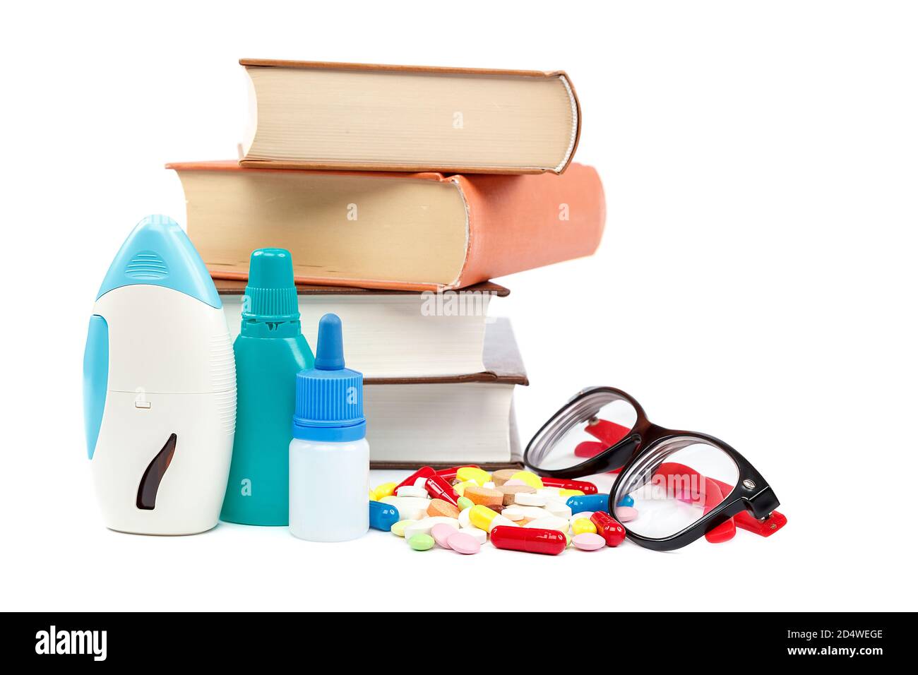 Stack of books and pills, capsules isolated on white background ...