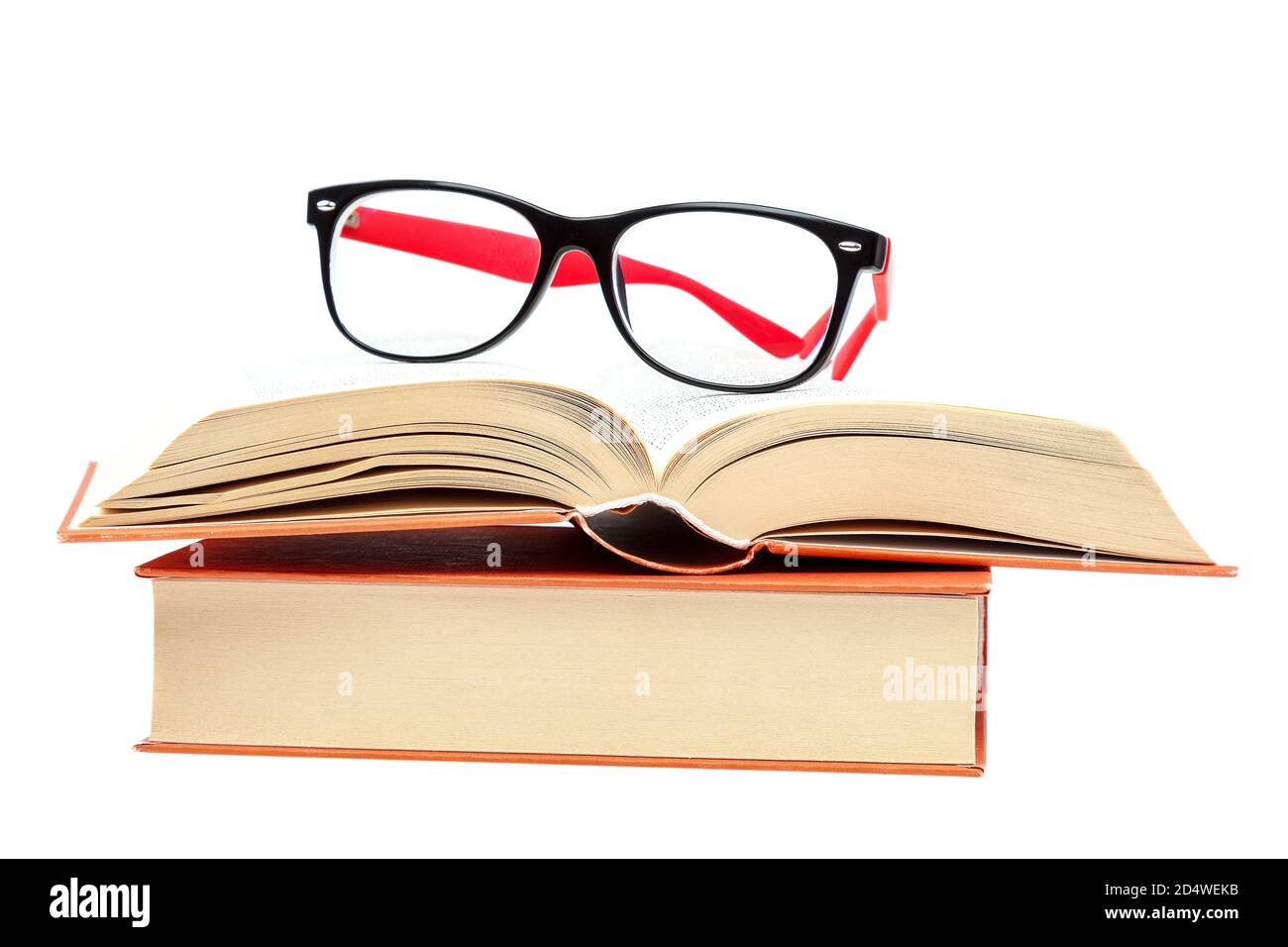 Open book and glasses on a stack of books isolated on white background ...