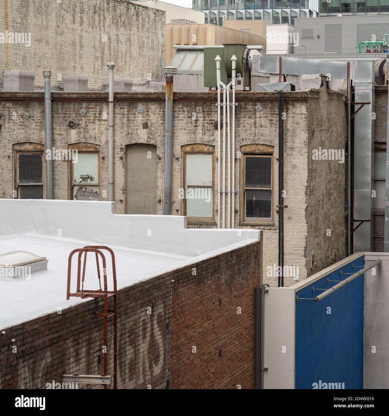 Rooftops in an alleyway Stock Photo - Alamy