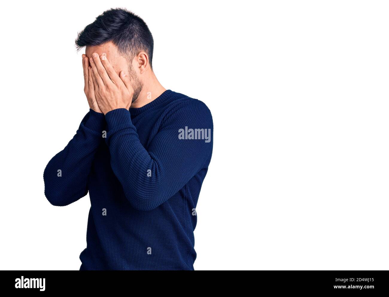 Young handsome man wearing casual clothes with sad expression covering ...