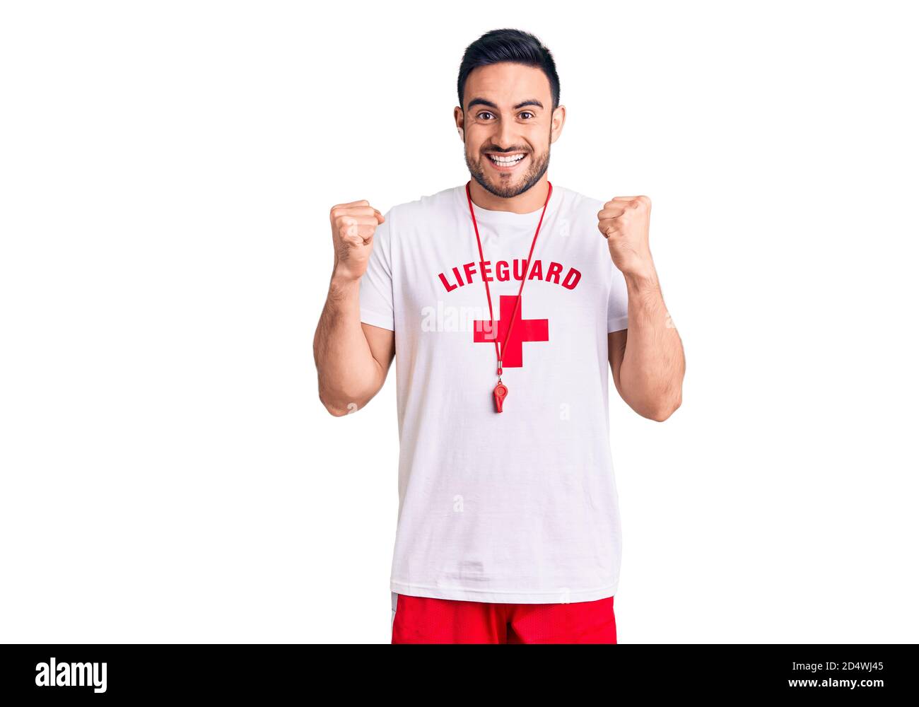 Young handsome man wearing lifeguard uniform celebrating surprised and ...
