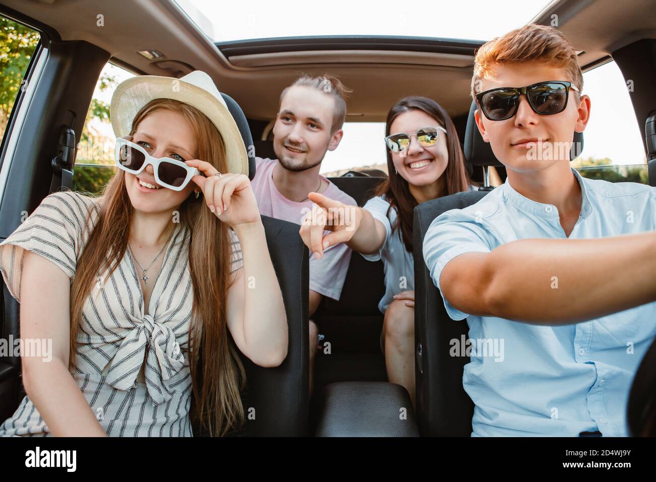 group of friends in car. road trip concept. summer vacation Stock Photo ...