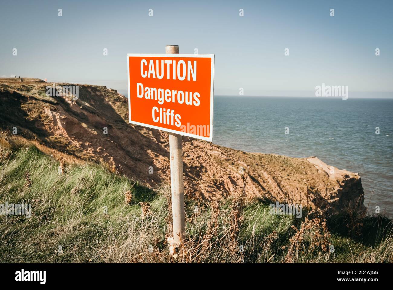 Danger warning sign with cliffs in background hi-res stock photography ...