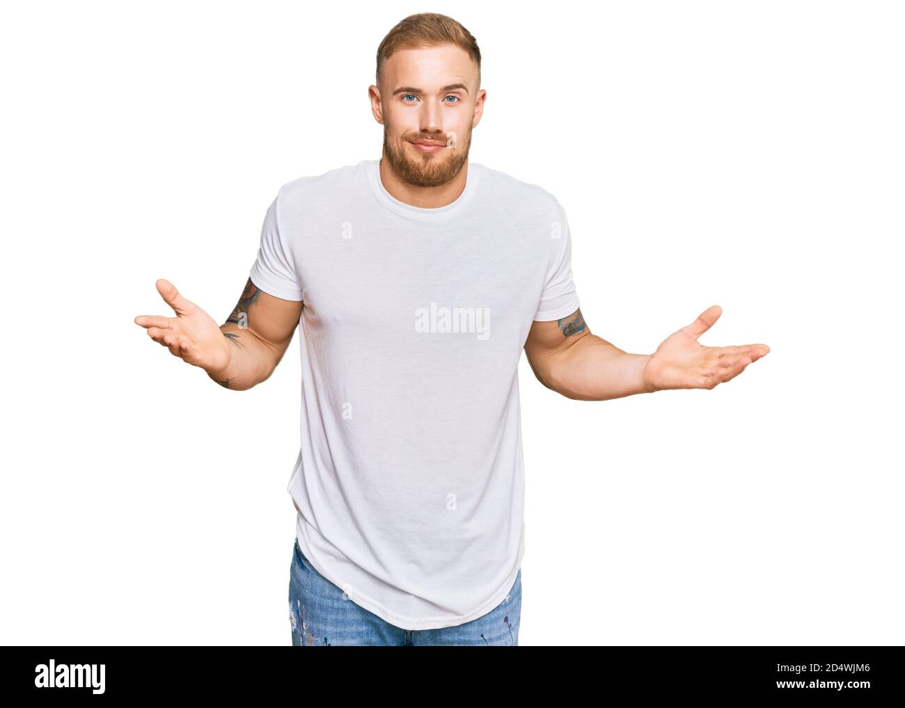 Young irish man wearing casual clothes clueless and confused expression ...