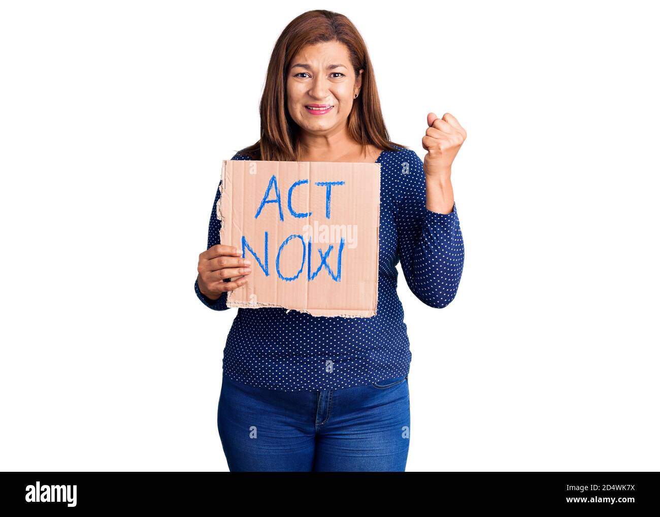Middle age latin woman holding act now banner annoyed and frustrated ...
