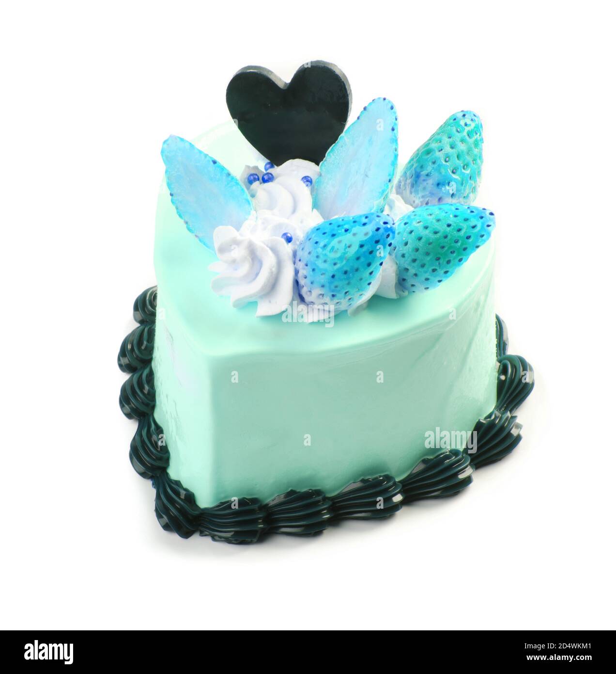 Small icing topped cake Stock Photo - Alamy