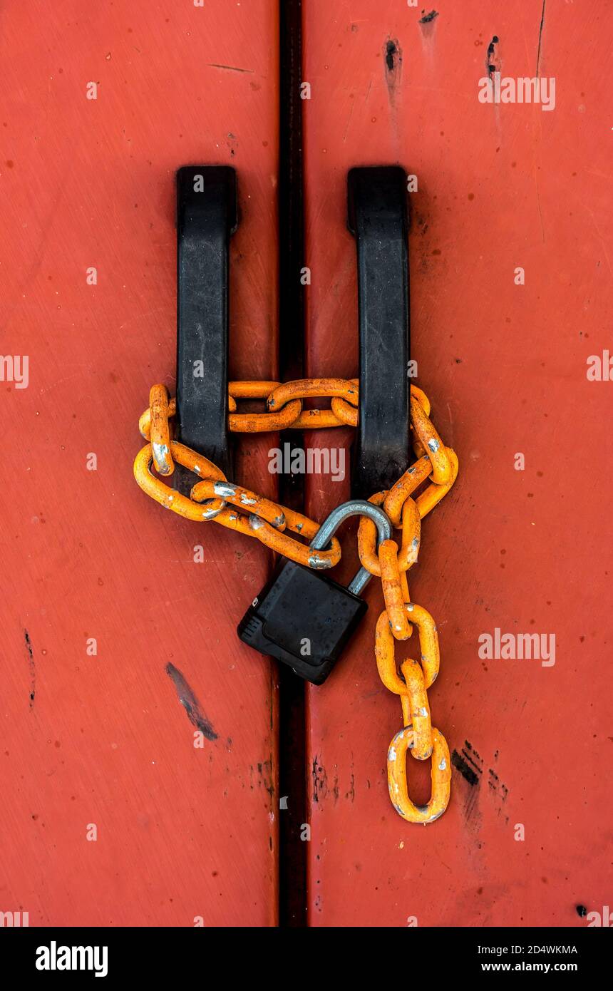Yellow chain with black padlock secure weather metallic doors Stock ...