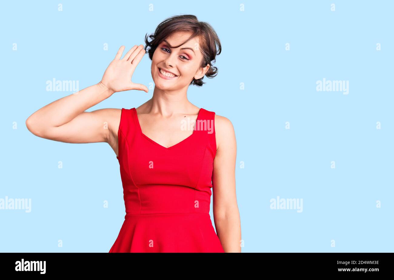 Beautiful young woman with short hair wearing casual style with ...