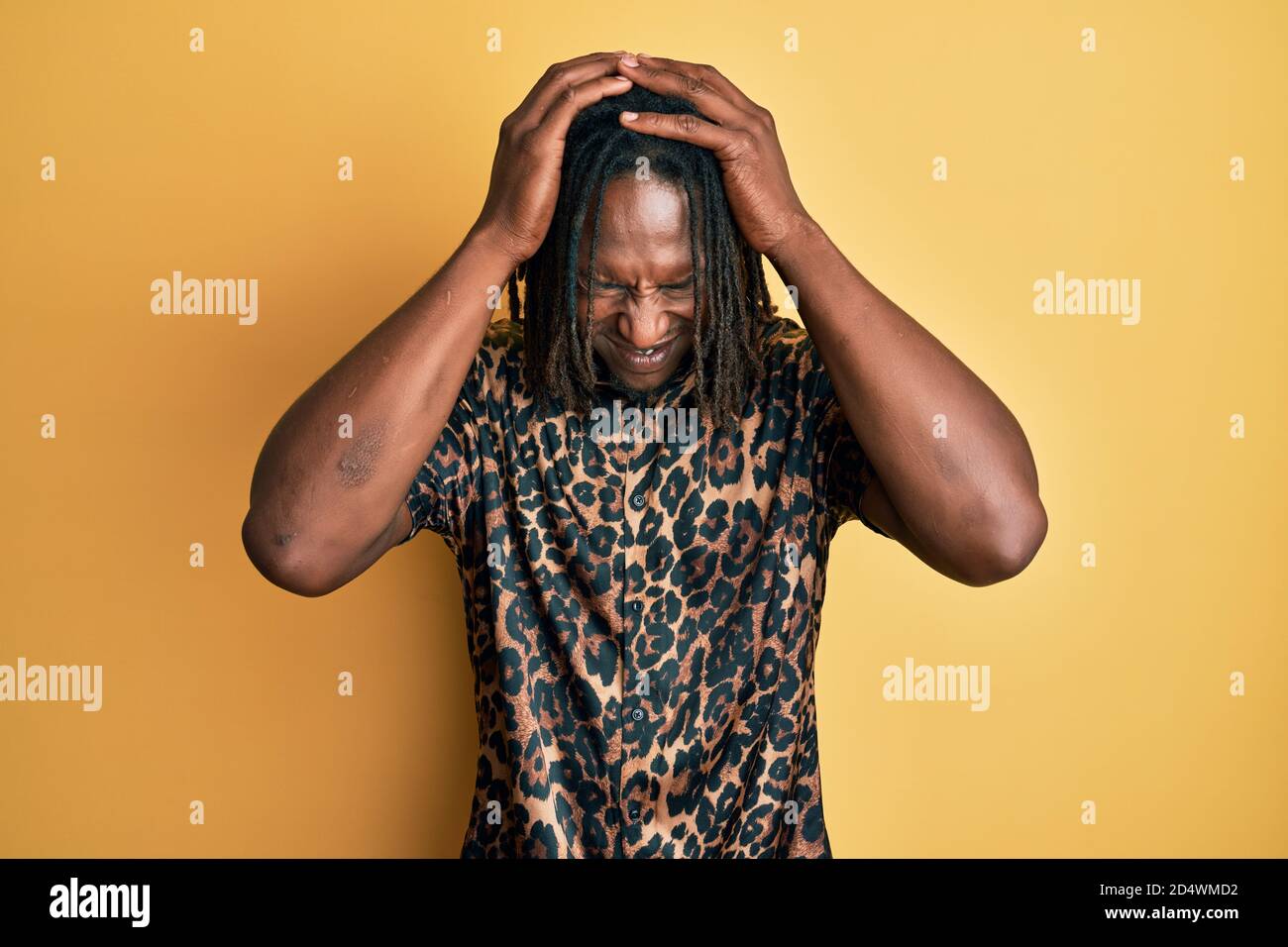 African american man with braids wearing leopard animal print shirt ...