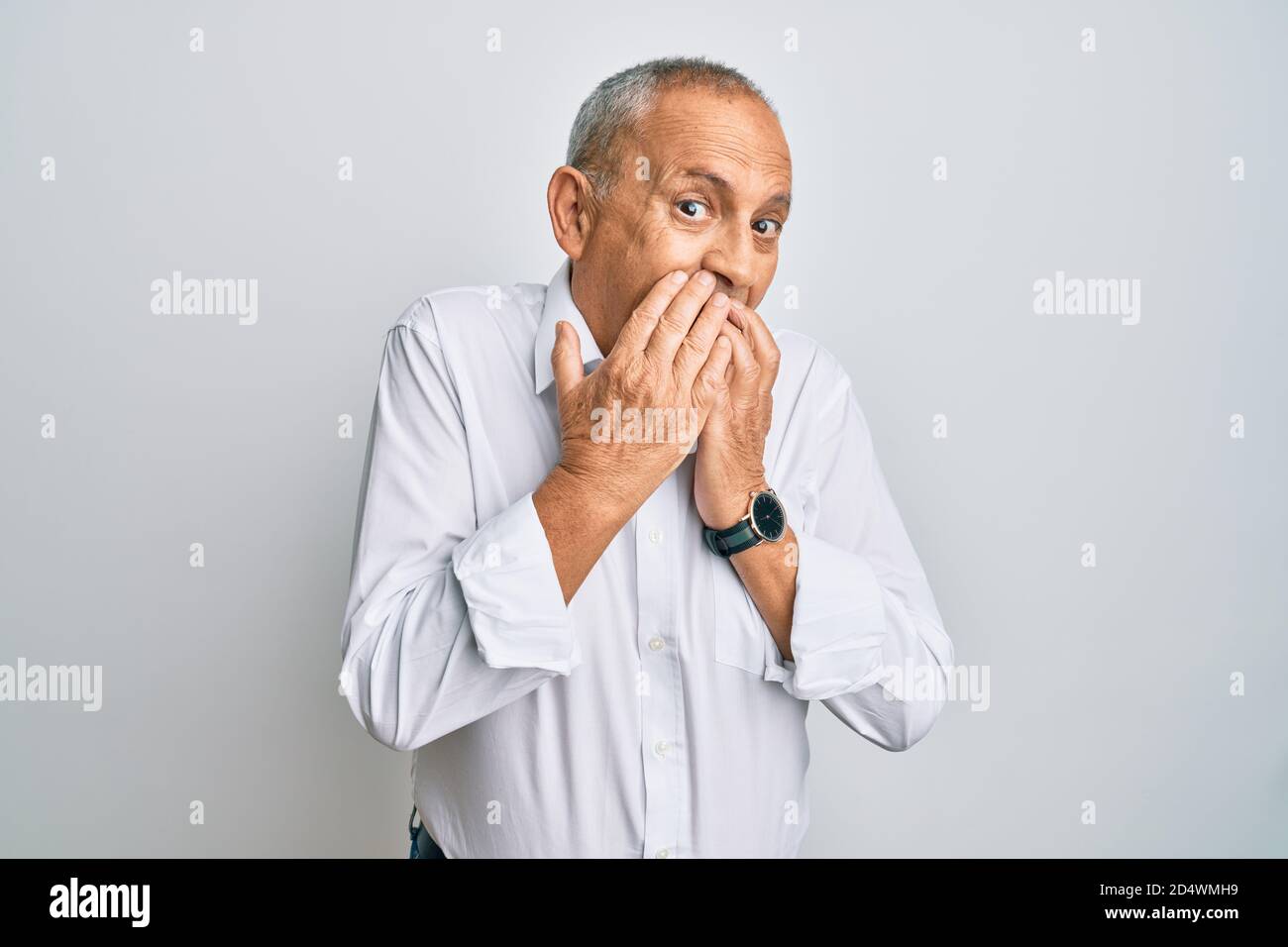 Handsome senior man wearing casual white shirt laughing and embarrassed ...