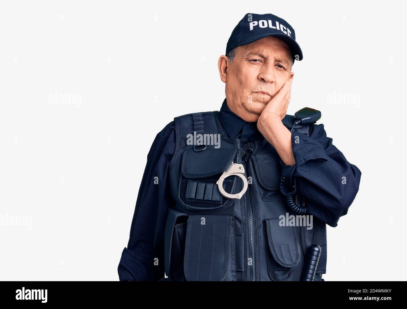 Senior handsome man wearing police uniform thinking looking tired and ...