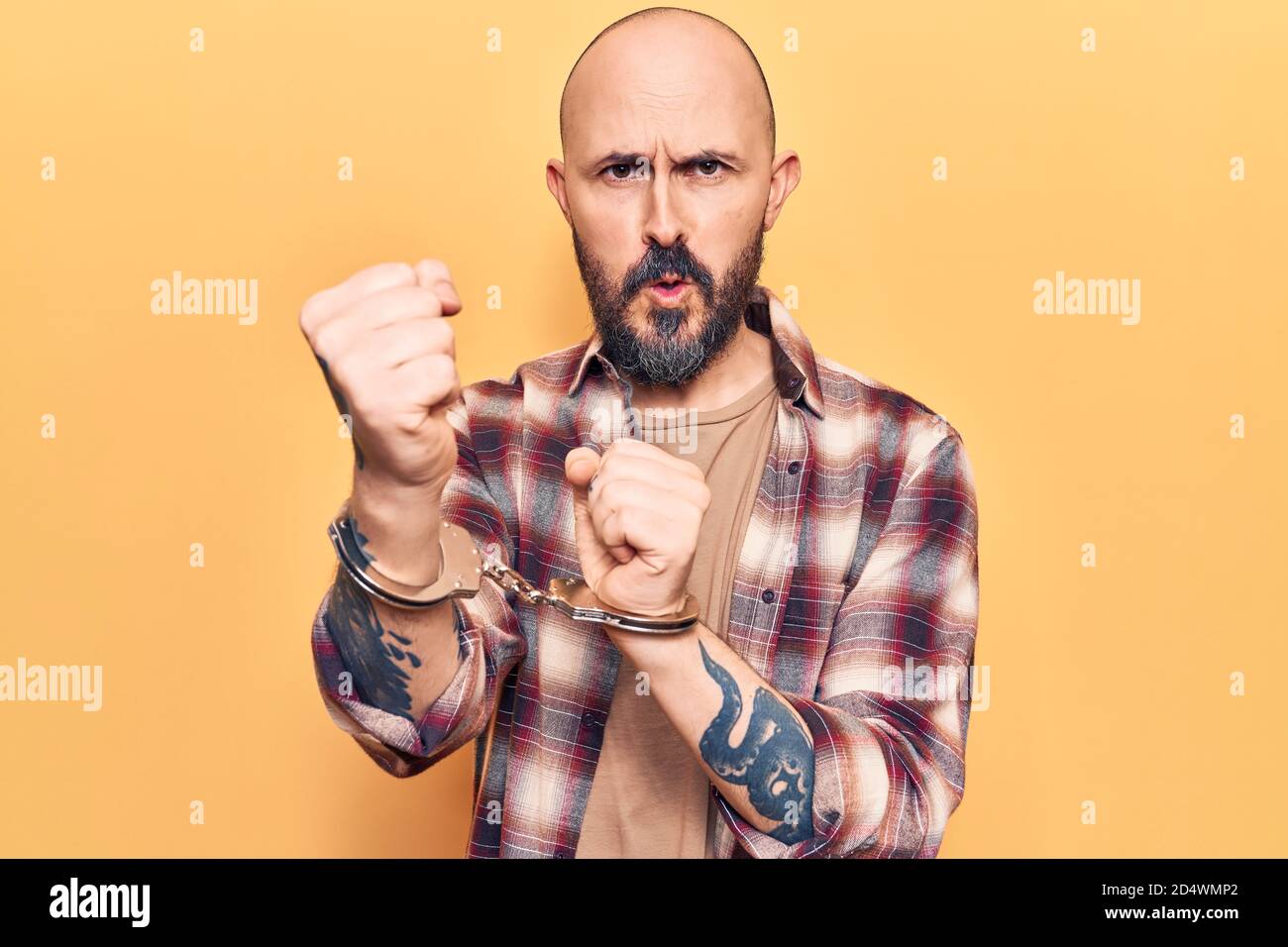 Young Handsome Man Wearing Prisoner Handcuffs Annoyed And Frustrated