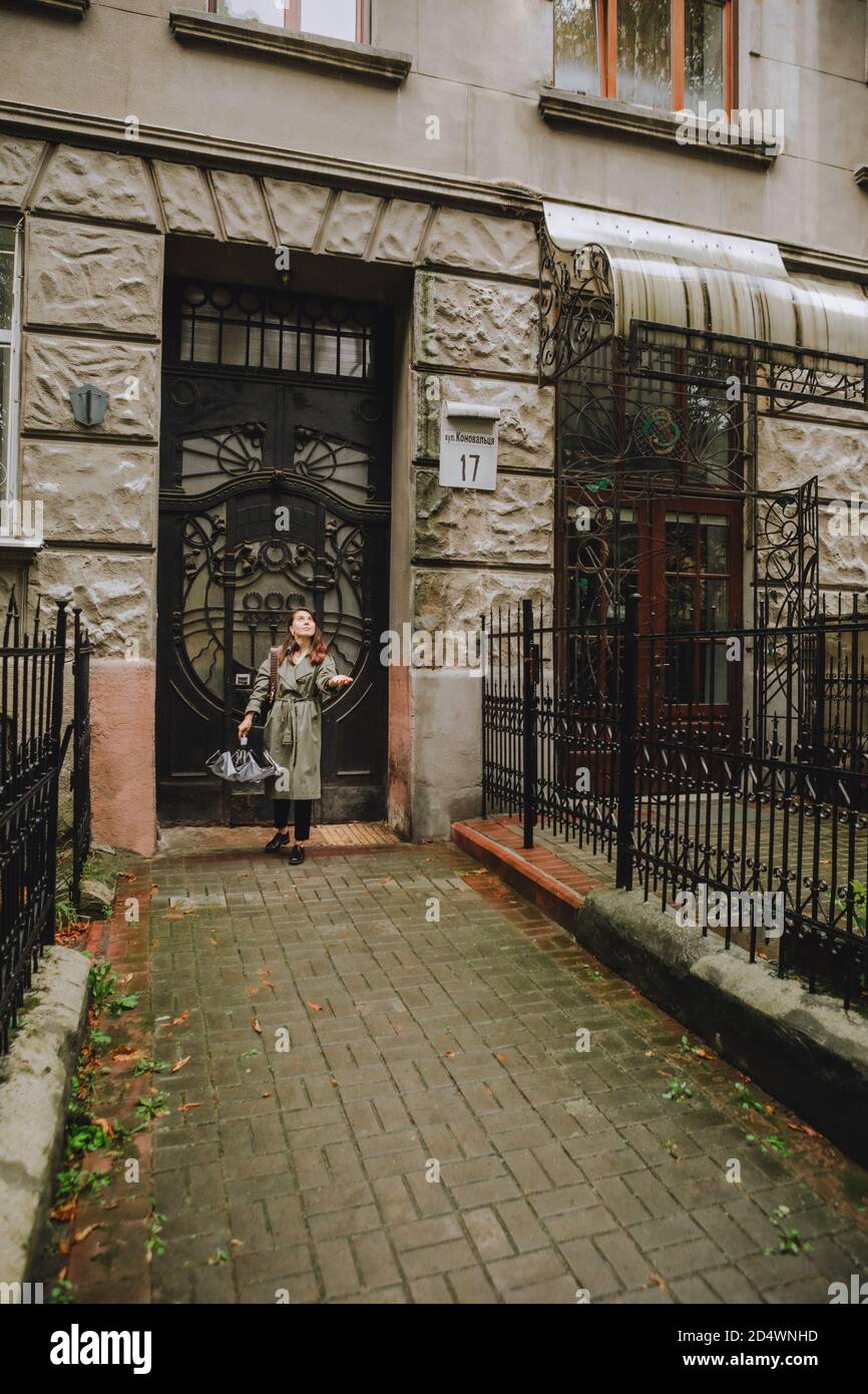 Woman opening umbrella hi-res stock photography and images - Alamy