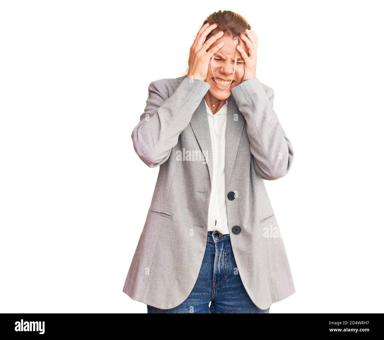 Young beautiful blonde woman wearing elegant jacket suffering from ...