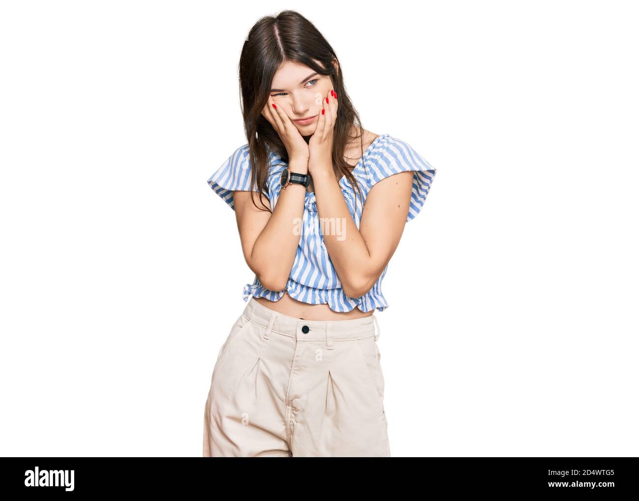 Young beautiful caucasian girl wearing casual clothes tired hands ...