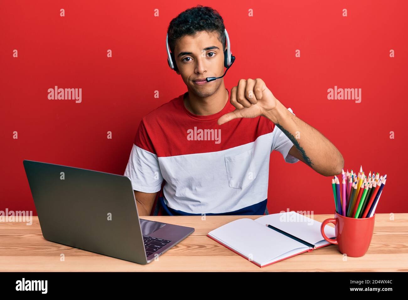 Young handsome african american man working at the office wearing ...