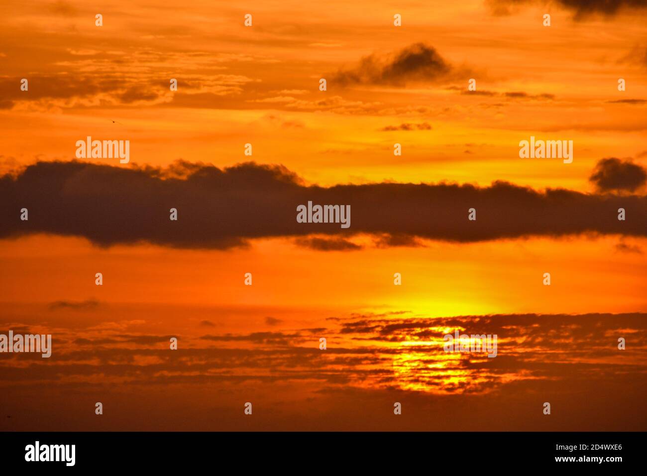 The Sun Setting in the Sea Stock Photo - Alamy