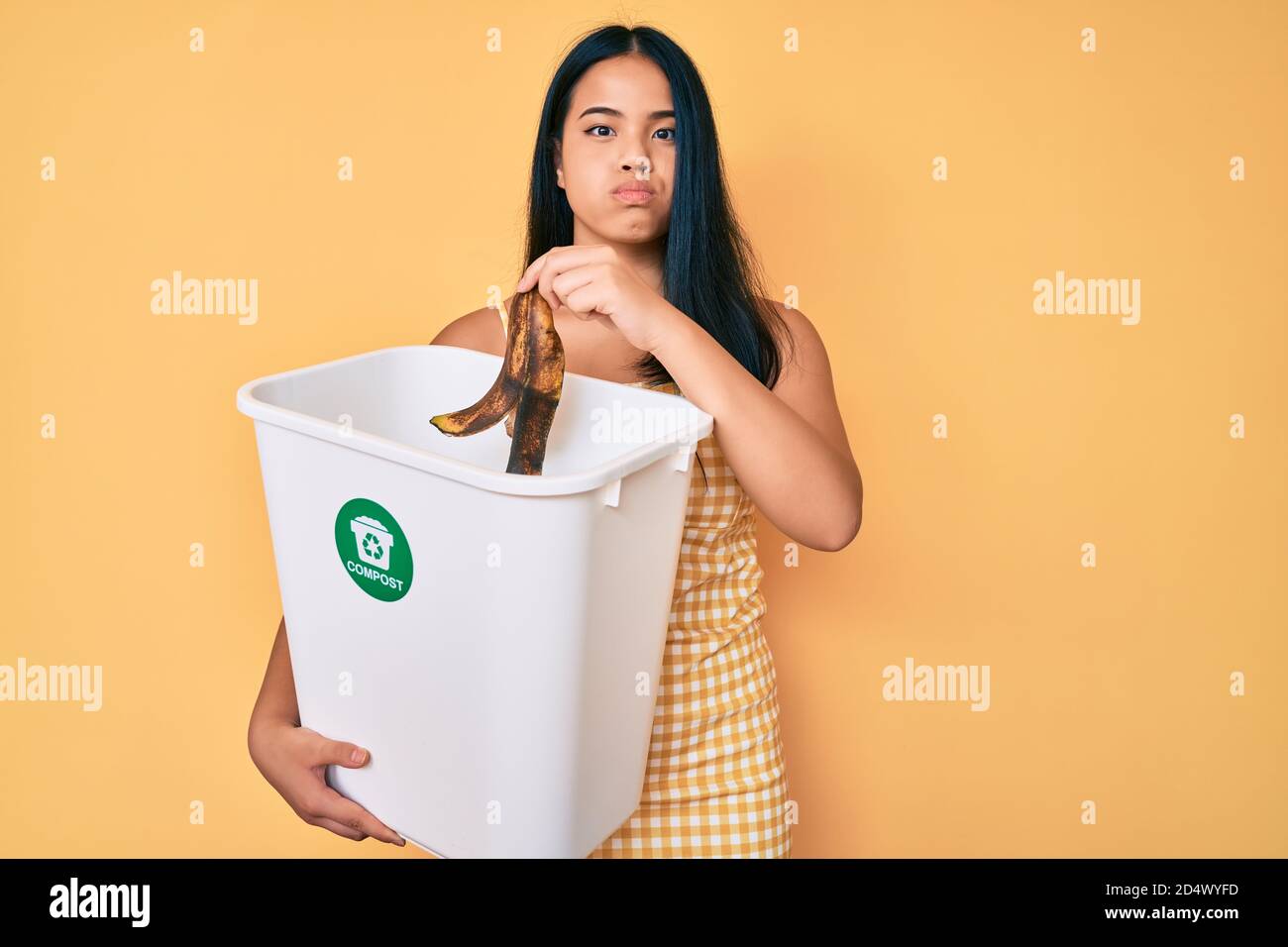 Young asian girl recycling food composting organic fertilizer puffing ...