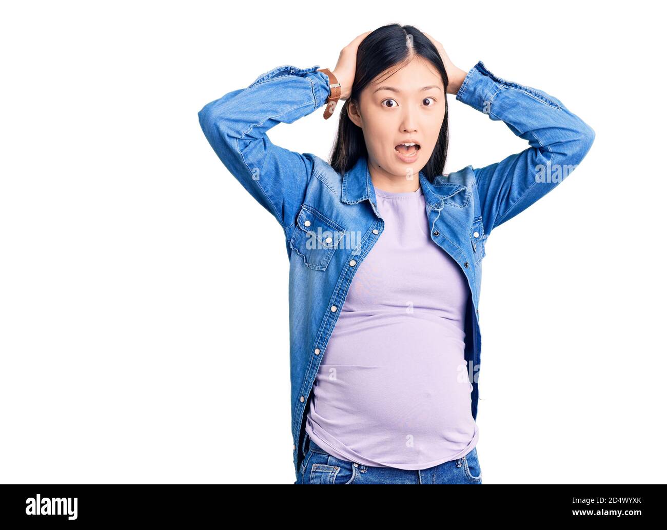 Young beautiful chinese woman pregnant expecting baby crazy and scared ...