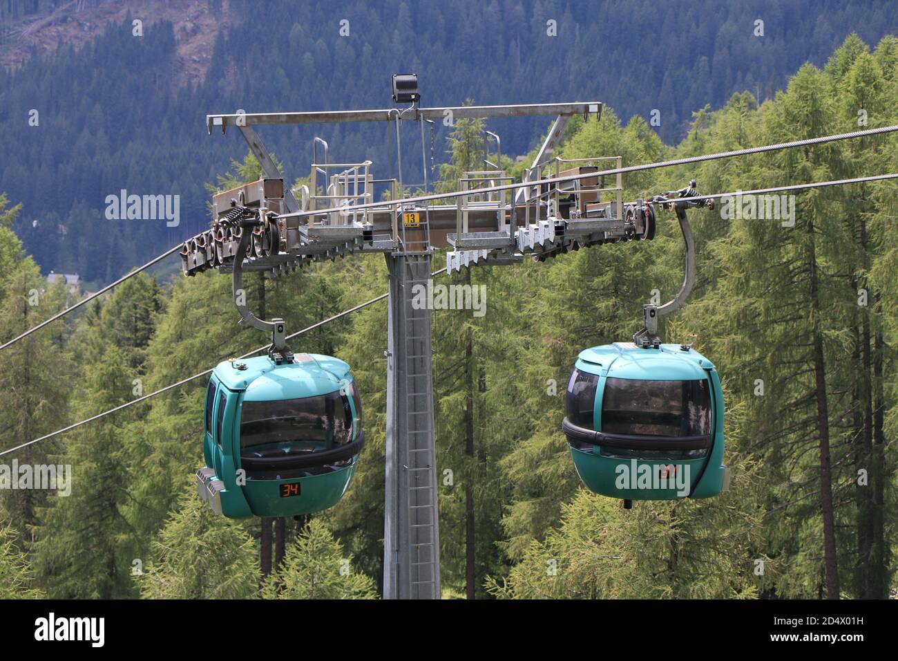 A cable car coming down the mountain. High quality photo of a funicular ...