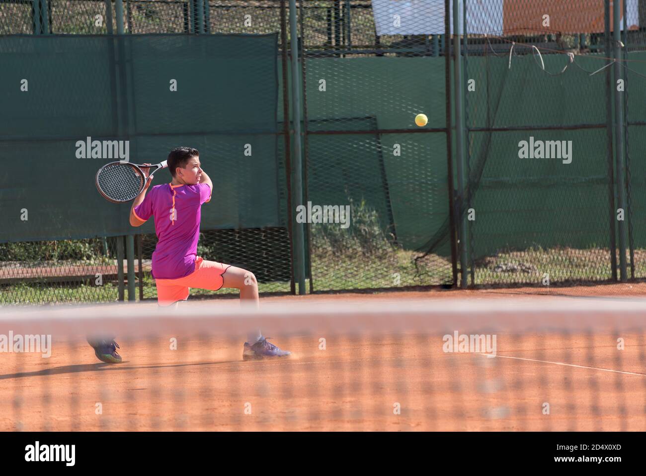Tennis player hitting backhand hi-res stock photography and images - Alamy