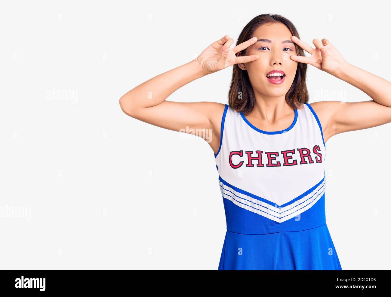 Young Beautiful Chinese Girl Wearing Cheerleader Uniform Doing Peace