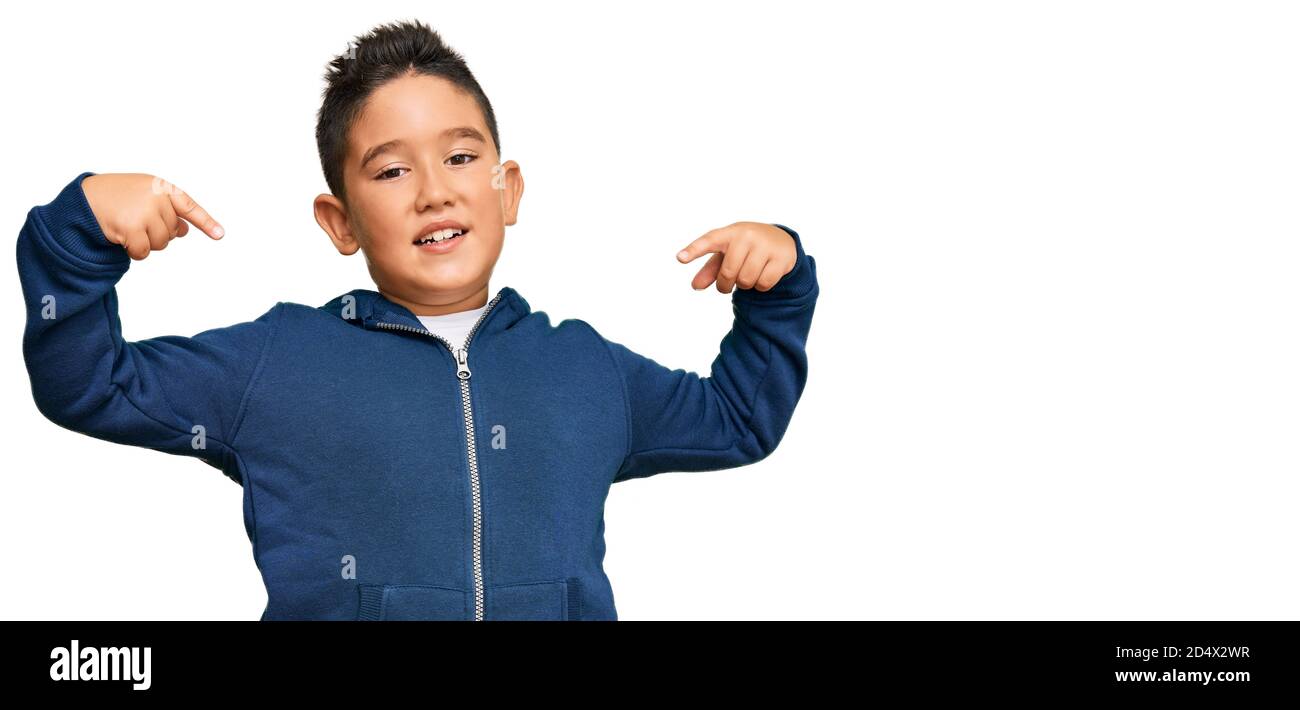 Little boy hispanic kid wearing casual sporty jacket looking confident ...