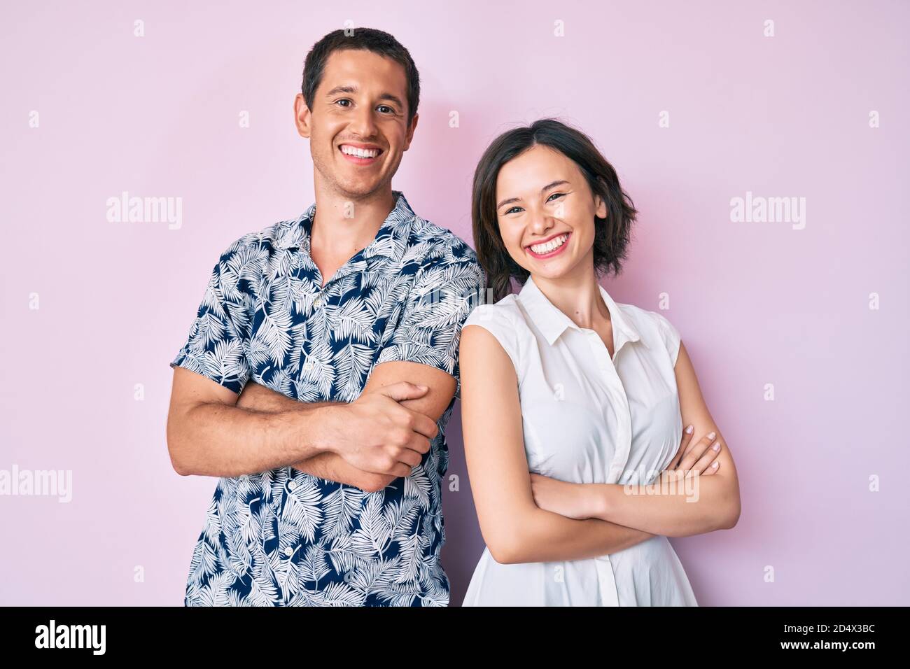 Beautiful couple wearing casual clothes happy face smiling with crossed ...