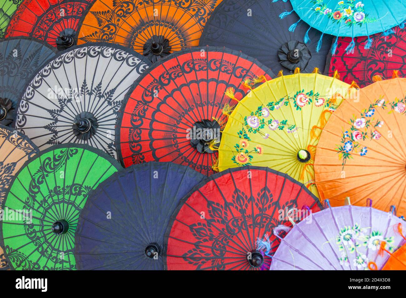 Display of traditional Burmese handmade parasols with different designs ...