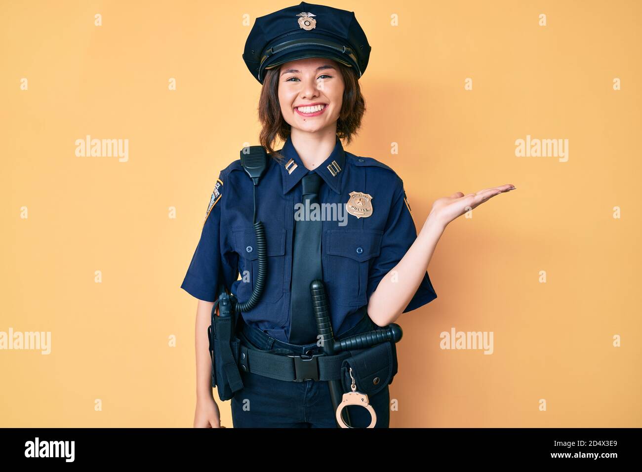 Young beautiful woman wearing police uniform smiling cheerful ...