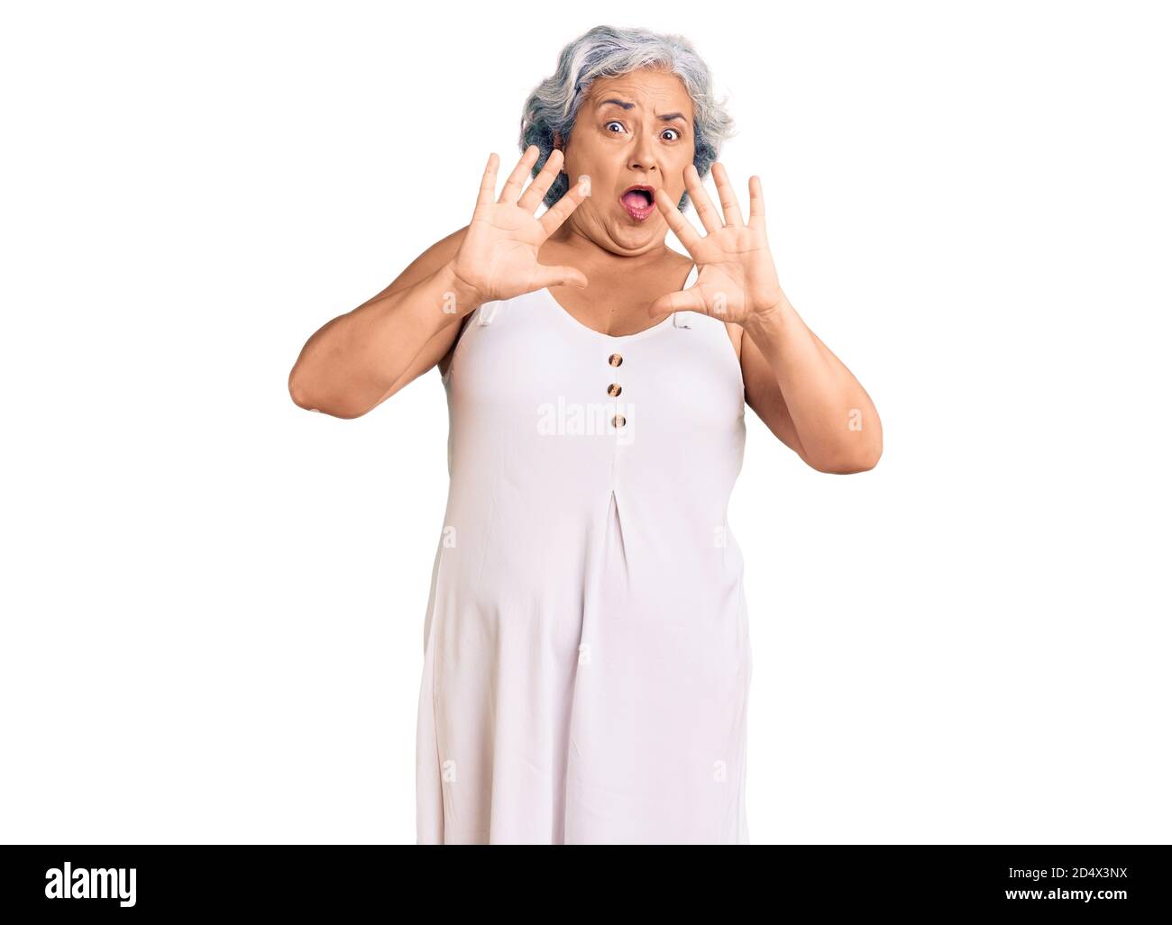 Senior woman with gray hair wearing casual clothes afraid and terrified ...