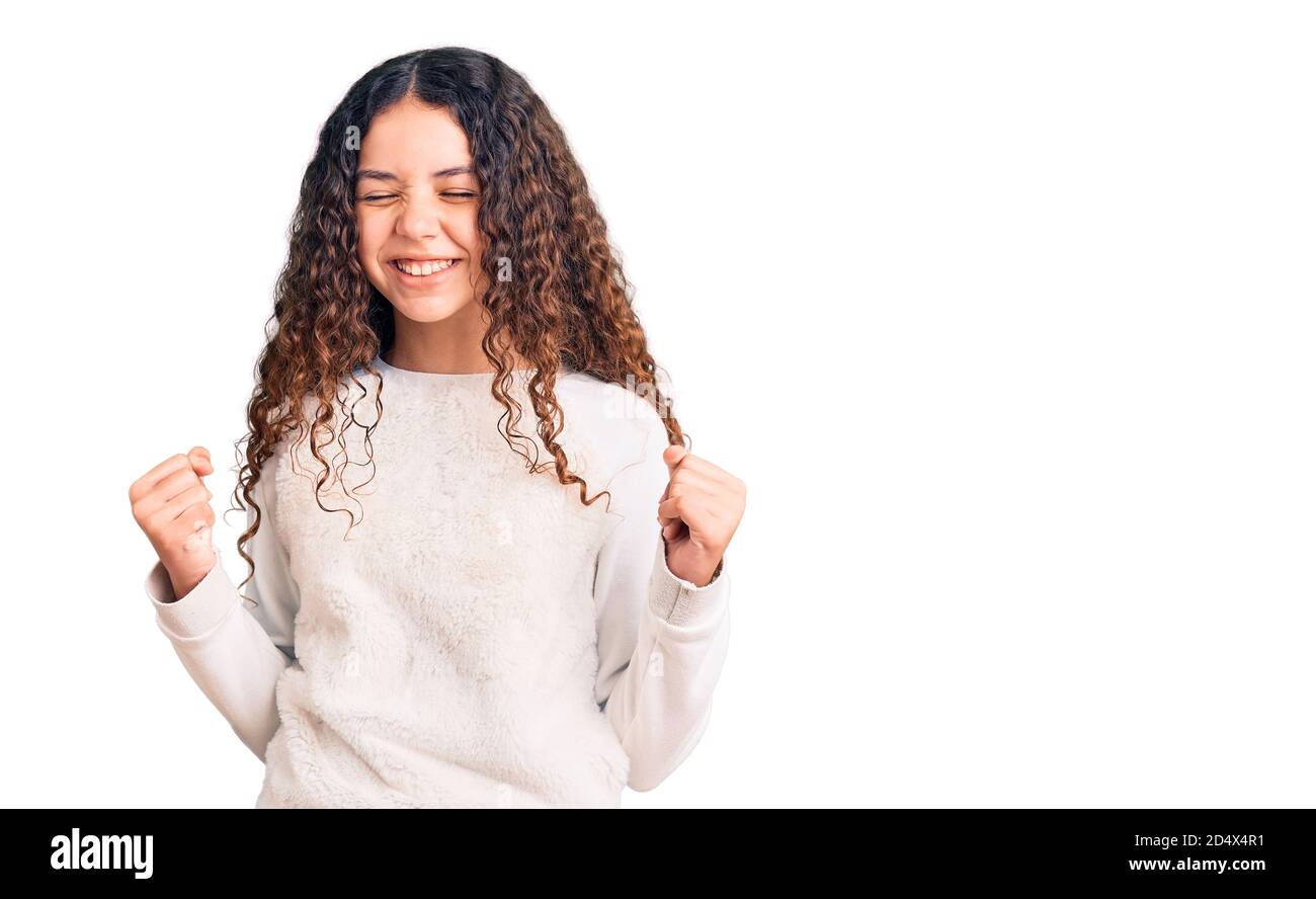 Beautiful kid girl with curly hair wearing casual clothes excited for ...