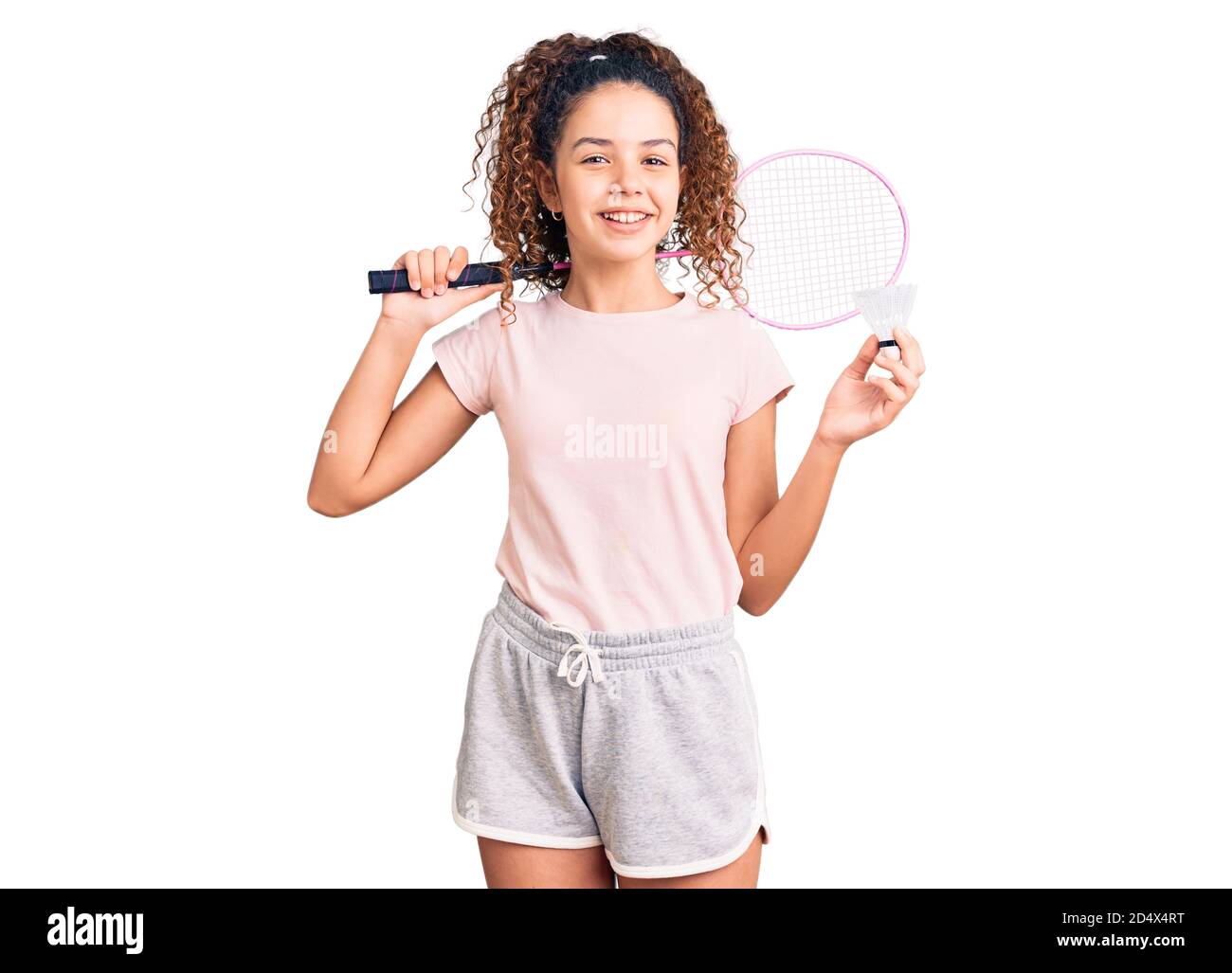 Beautiful kid girl with curly hair holding badminton racket and ...